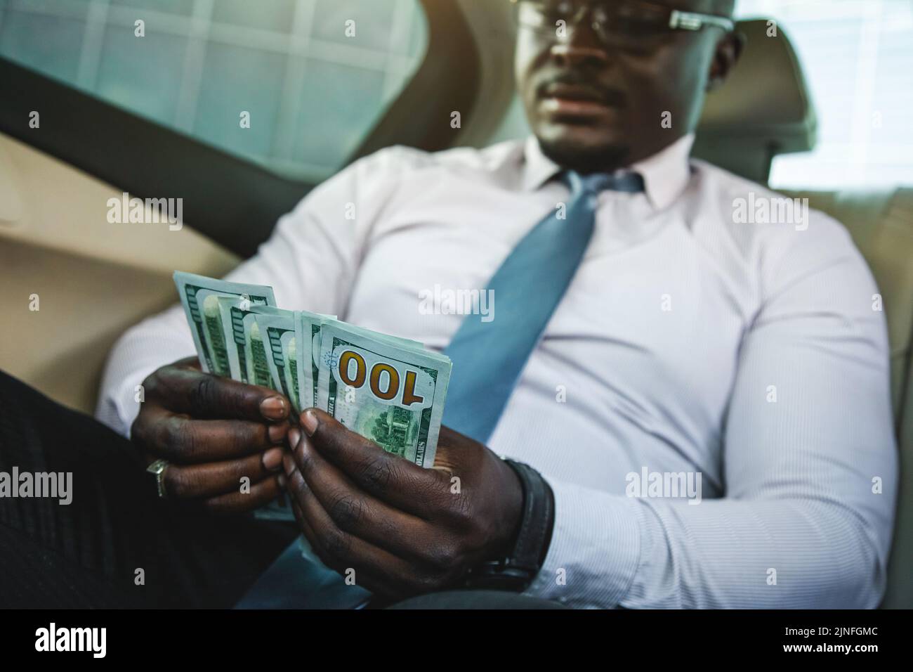 Recalculation of earned paper money. Close-up of a man's hands counting ...