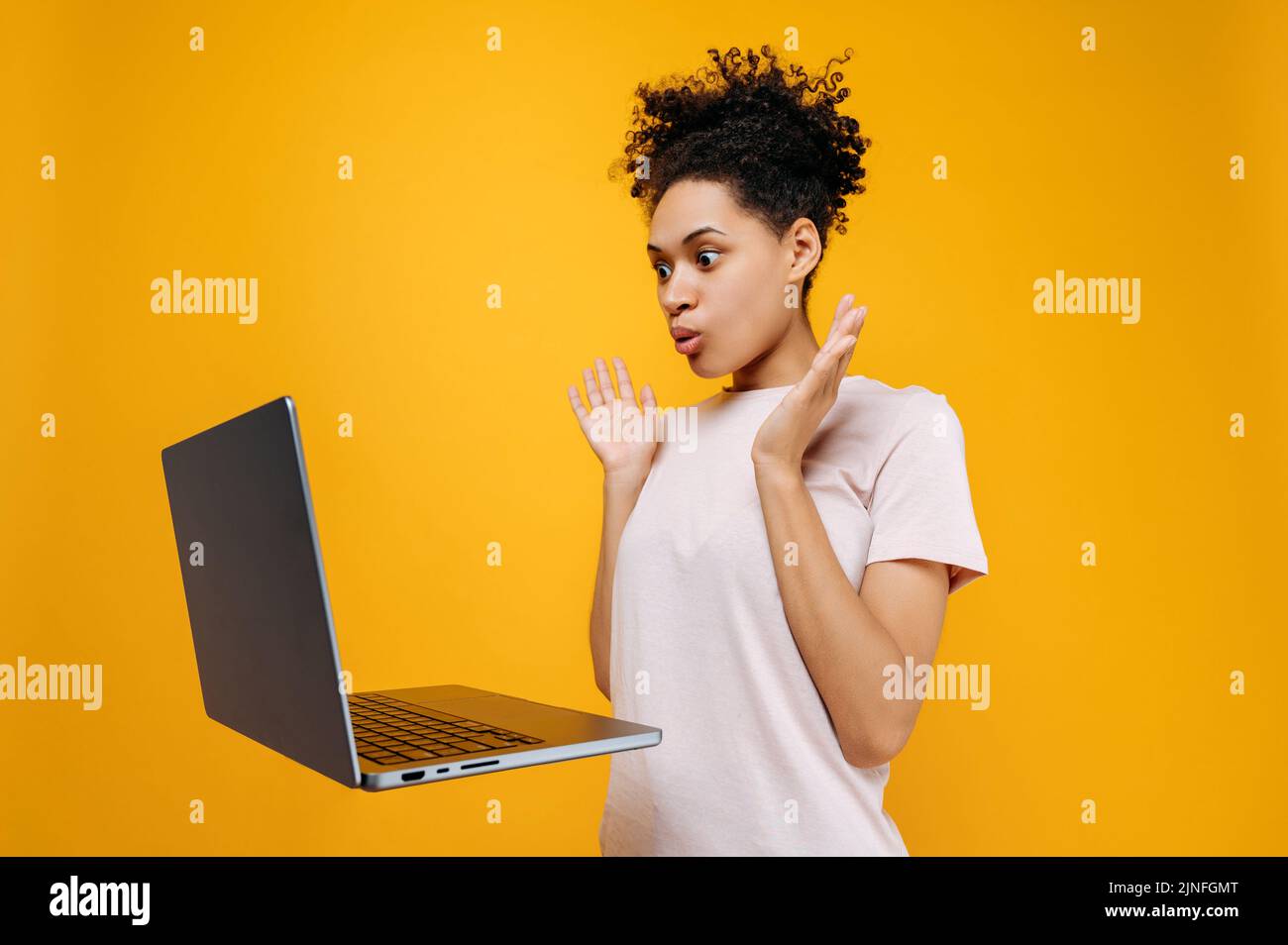 Emotional Puzzled Shocked Curly Haired African American Young Woman