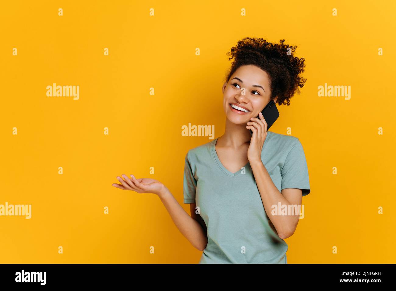 Phone talk by mobile phone. Happy excited african american young woman ...