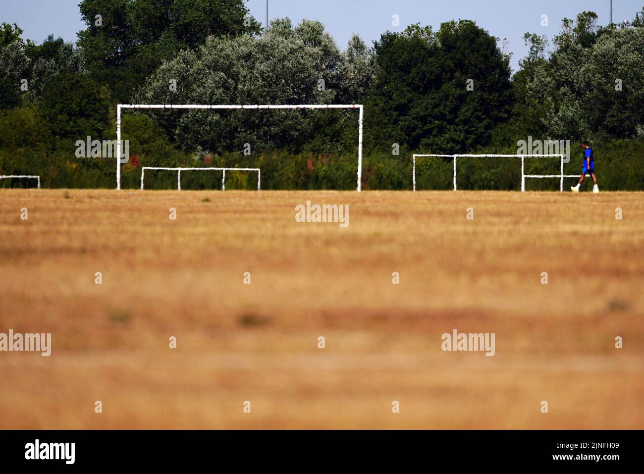 A general view of dry grass on the football pitches at Hackney Marshes ...
