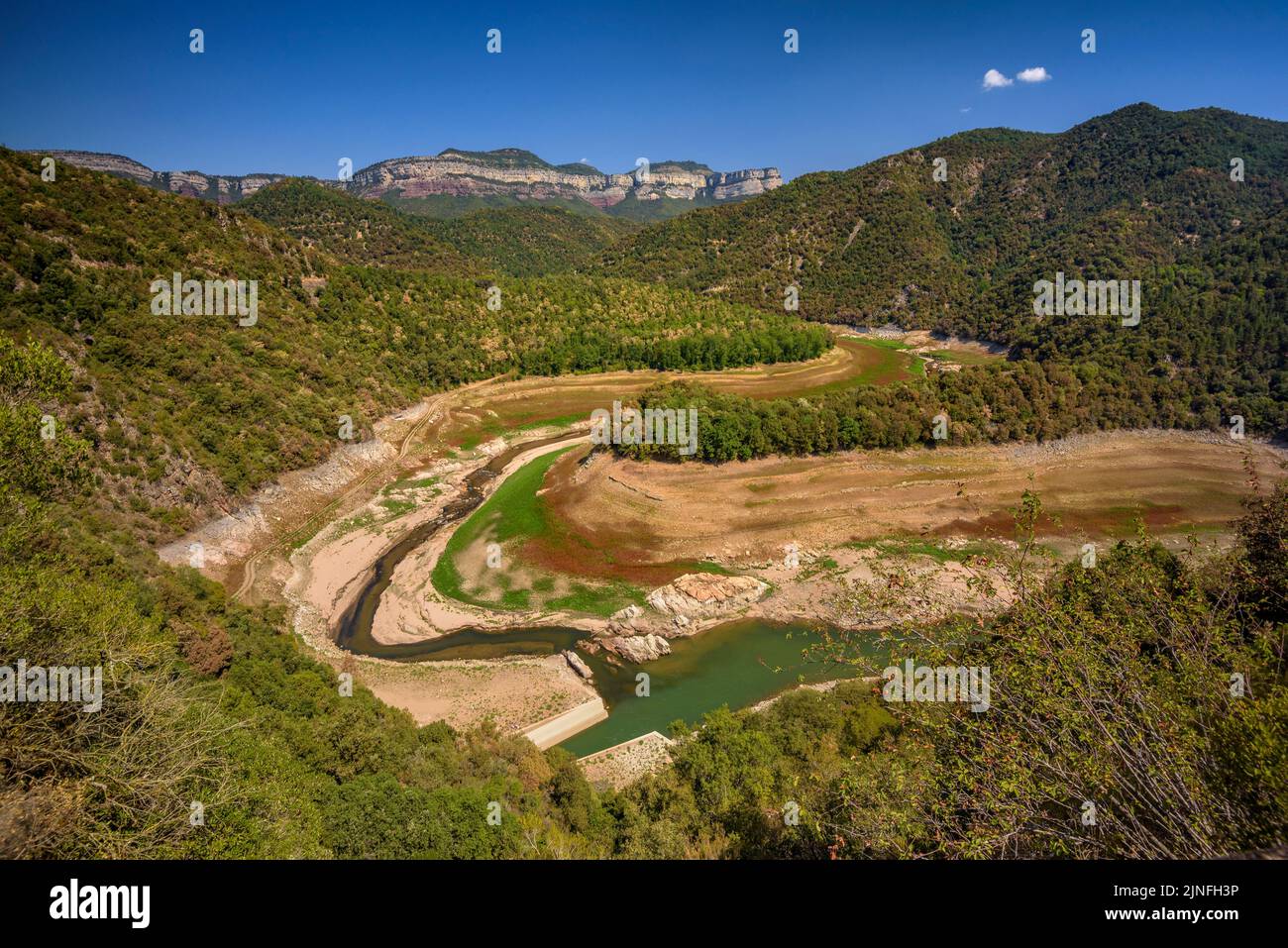 Dry tail meander of the Susqueda reservoir during the summer drought of ...