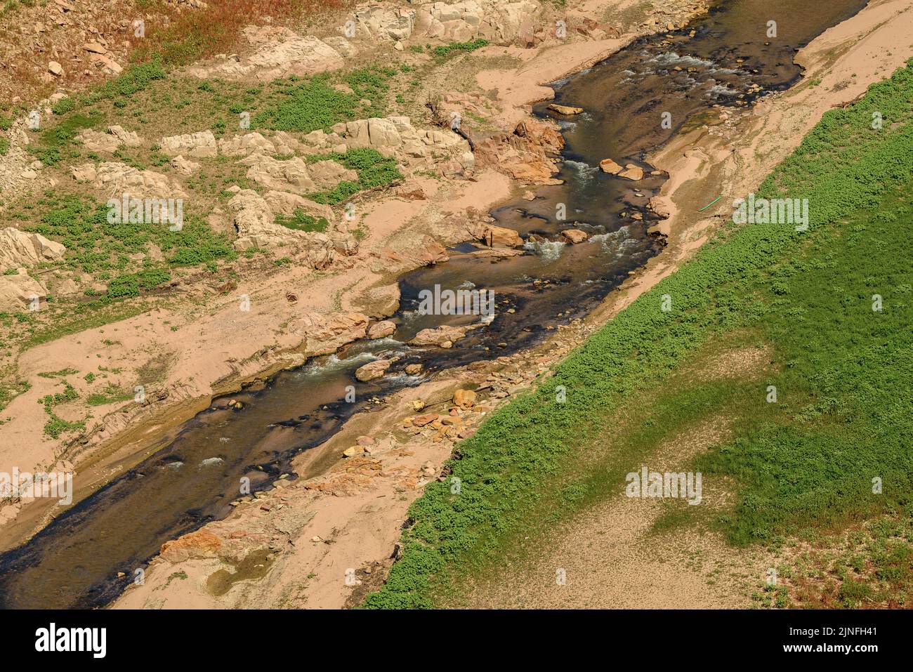 Dry tail meander of the Susqueda reservoir during the summer drought of ...