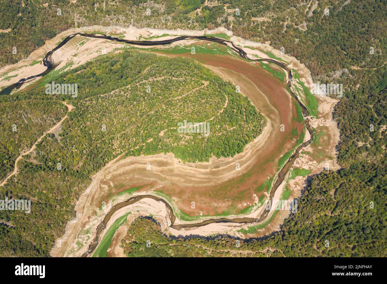 Dry tail meander of the Susqueda reservoir during the summer drought of ...