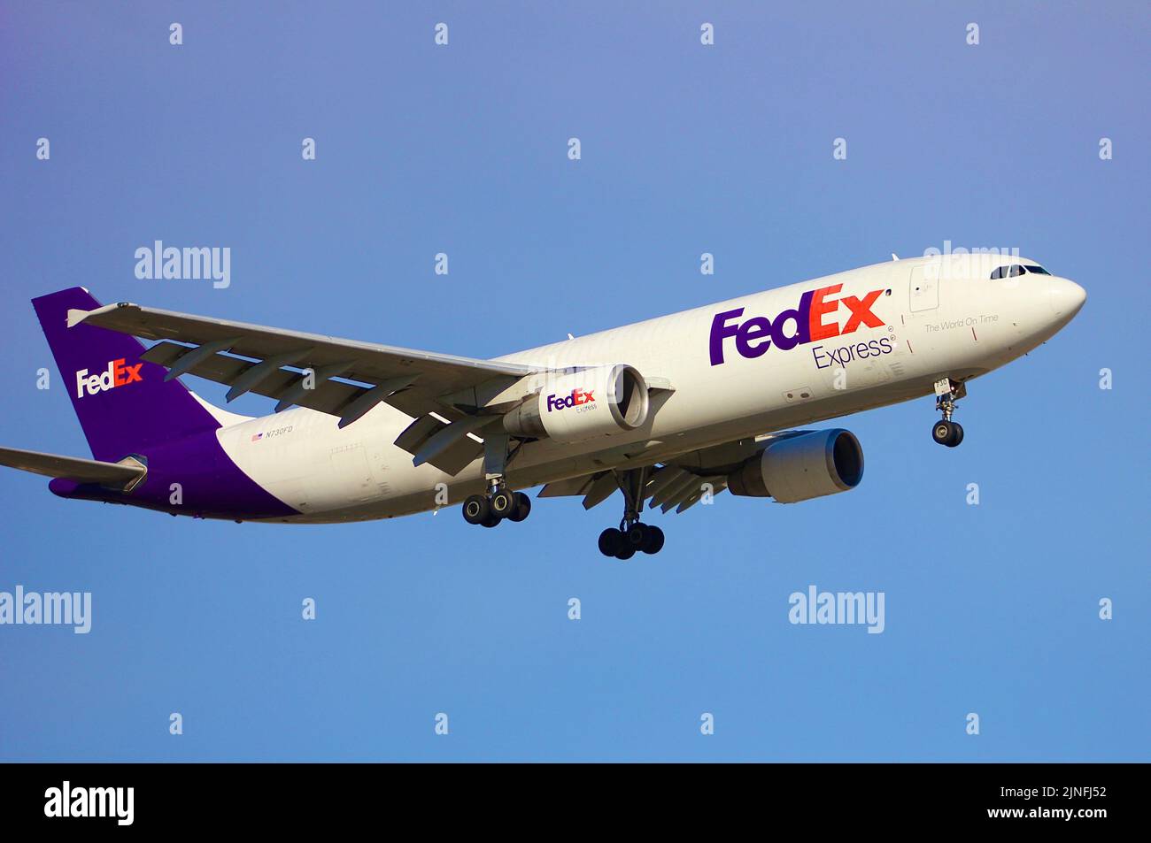 A beautiful view of a large cargo FedEx plane in the sky Stock Photo ...