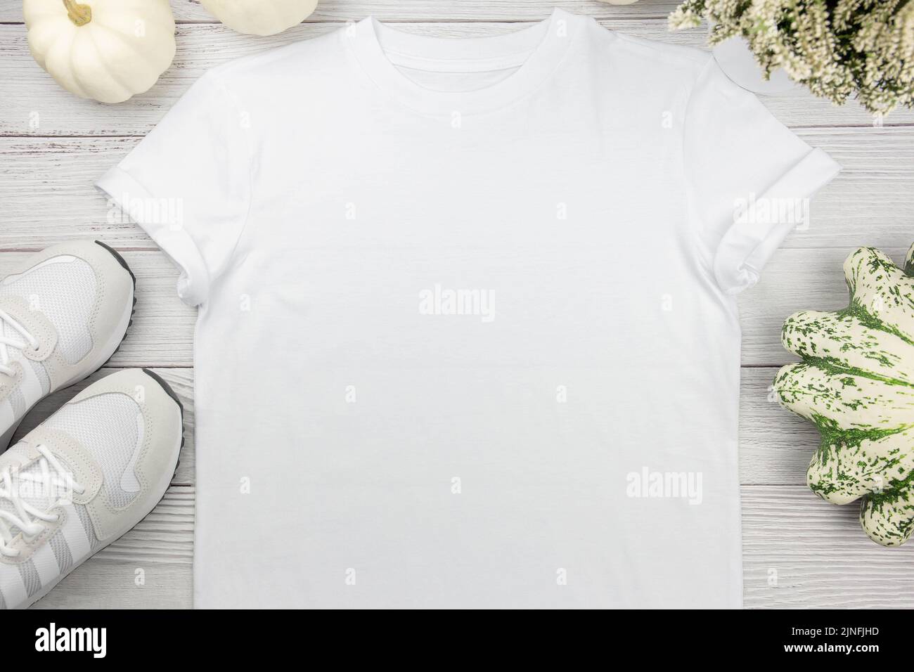 White Womens Cotton T Shirt Mockup With Pumpkins And Sneaker On White