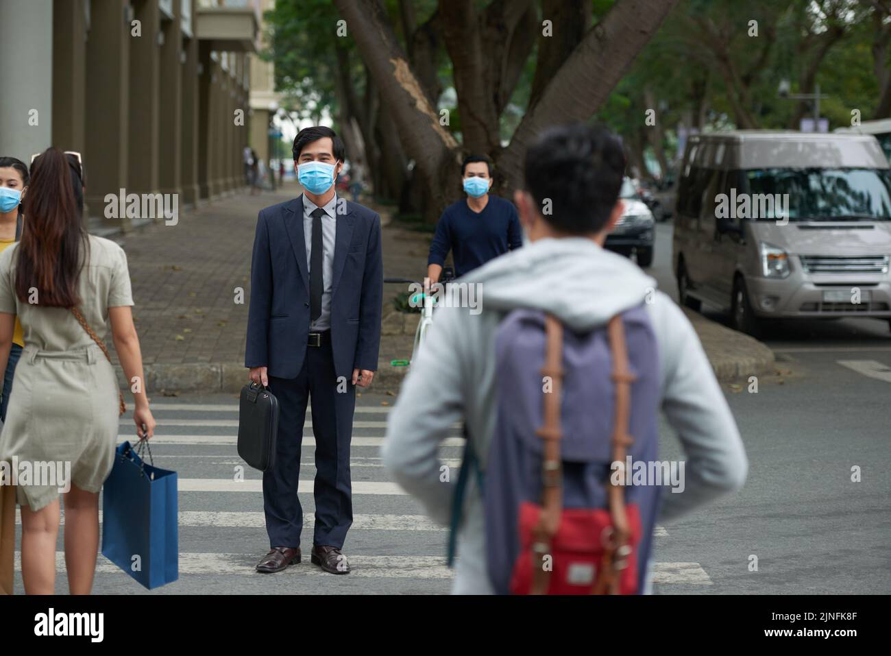 Businessman crossing hands hi-res stock photography and images - Alamy