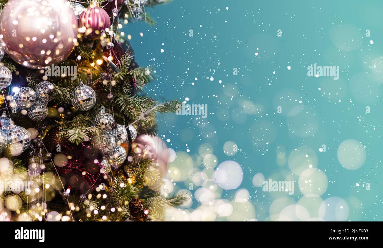 Magically decorated Christmas Tree with balls, ribbons and garlands on ...