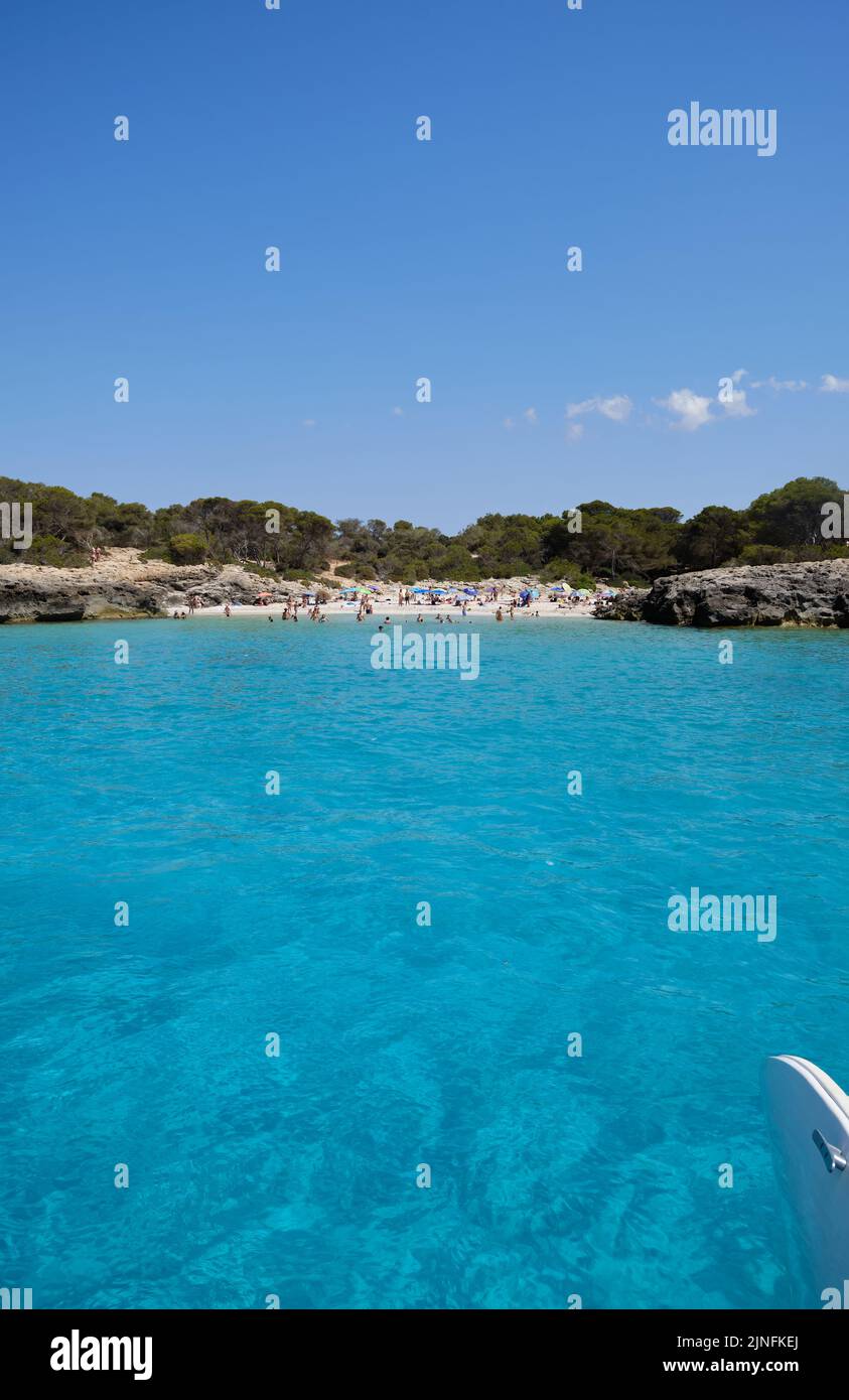 Menorca, Spain: Beautiful bay with sailing boat catamaran Stock Photo ...