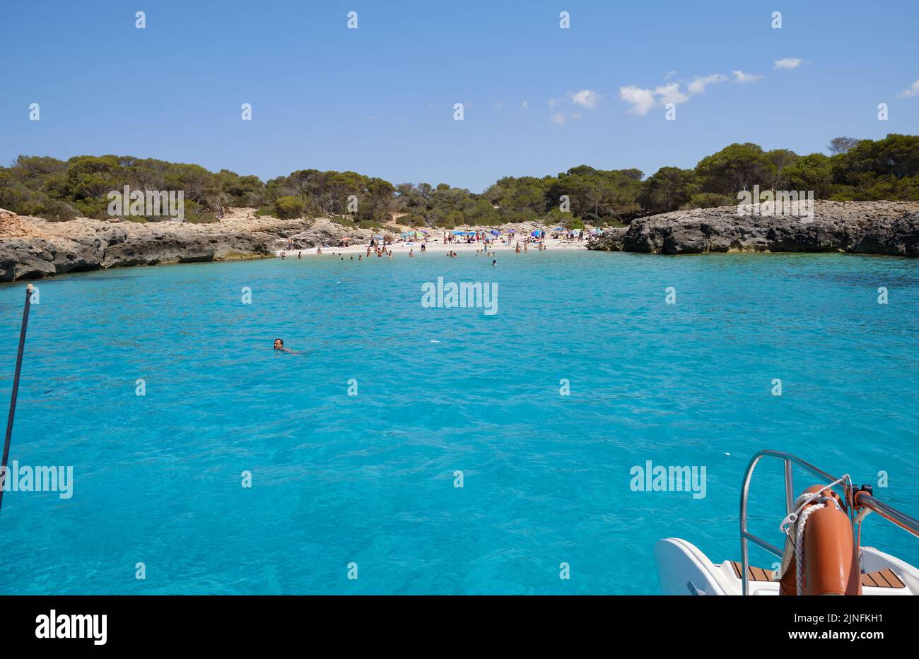 Menorca, Spain: Beautiful bay with sailing boat catamaran Stock Photo ...