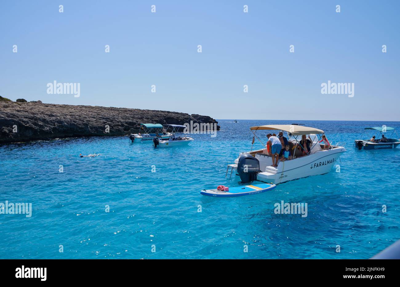 Menorca, Spain: Beautiful bay with sailing boat catamaran Stock Photo ...