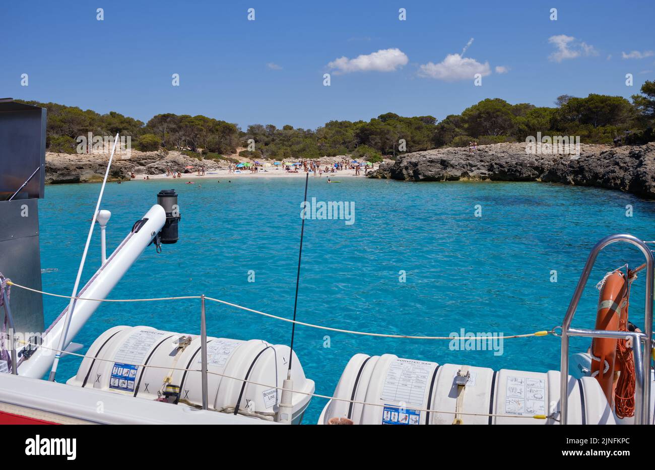 Menorca, Spain: Beautiful bay with sailing boat catamaran Stock Photo ...