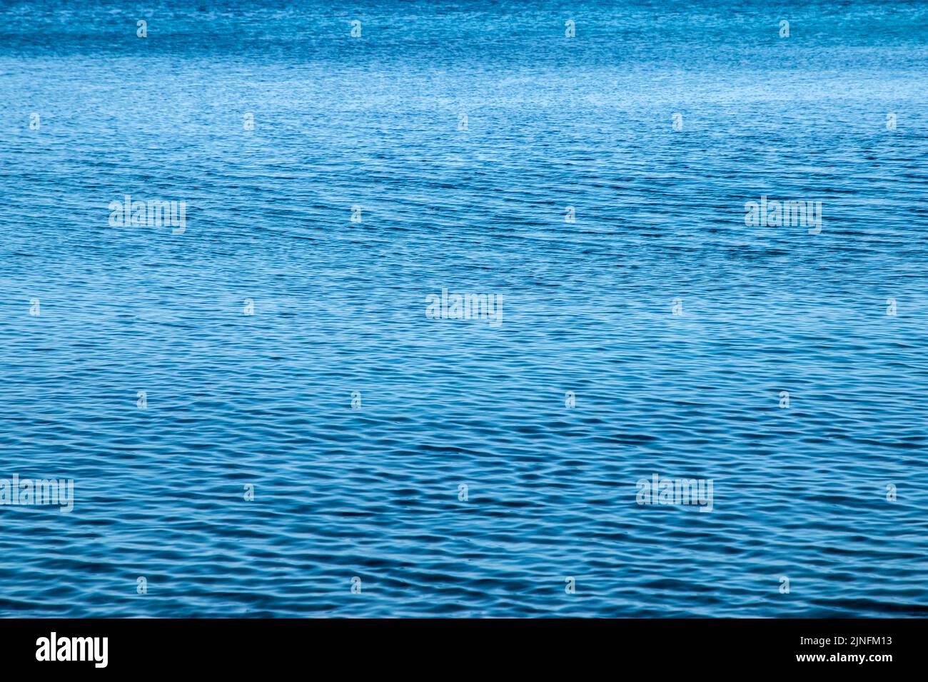 Clear calm blue sea waters surface closeup as water background Stock ...