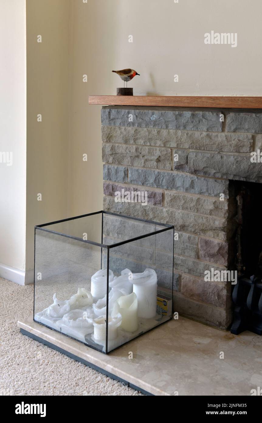 1970's period granite brick fireplace with glass box of part burned ...