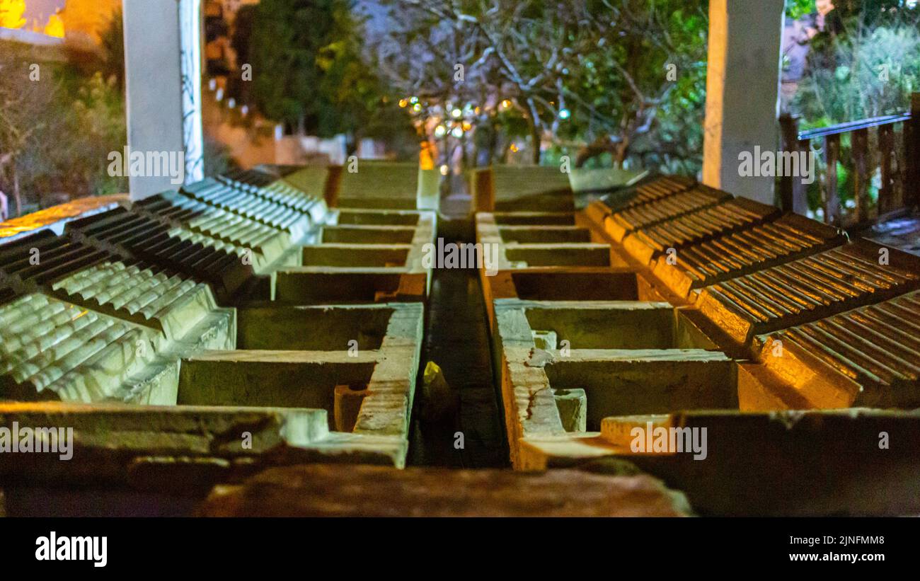 A hand washing public laundry in Chefchaouen by night, Morocco Stock ...