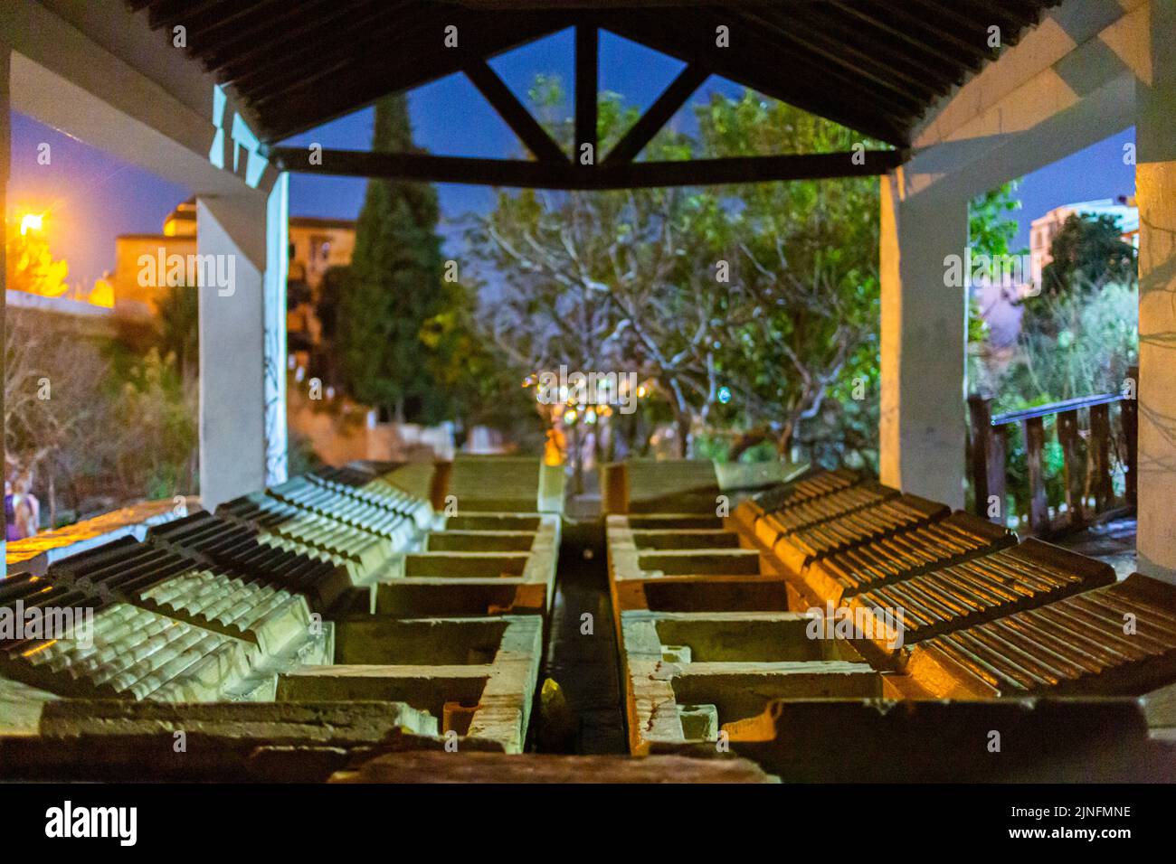 A hand washing public laundry in Chefchaouen by night, Morocco Stock ...