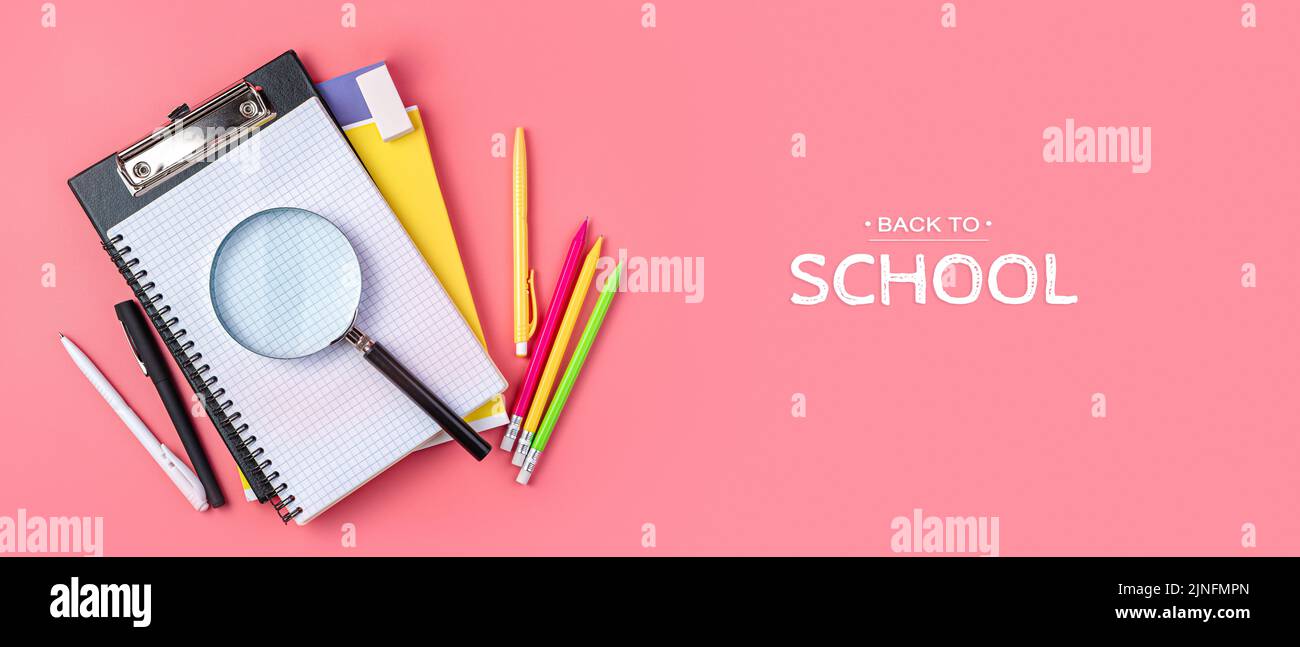 Back to school. Background with school supplies on a pink background ...