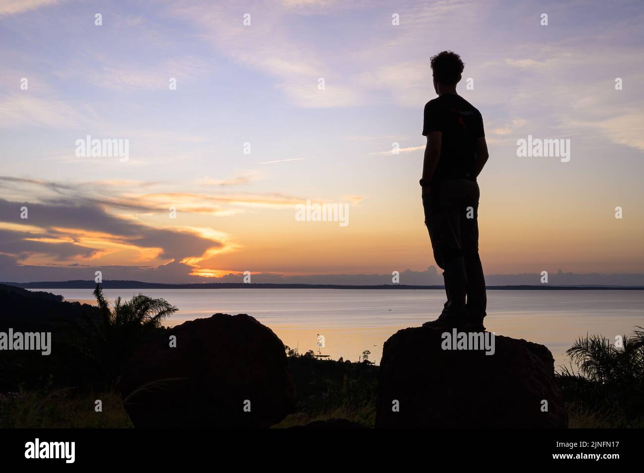 Person standing lake watching hi-res stock photography and images - Alamy
