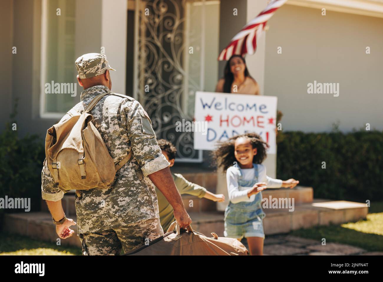 Welcoming daddy from the army. Military dad receiving a warm welcome ...