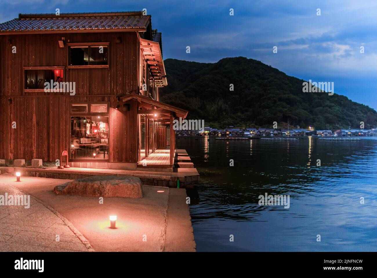 Traditional wooden boathouse converted into cafe-restaurant at water's ...