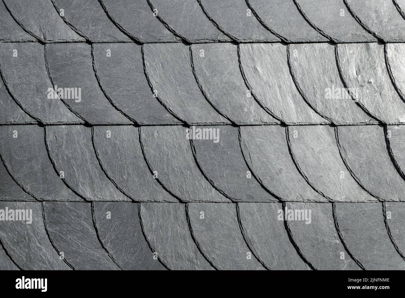 Detail close-up of natural grey stone shingle slate tiles texture roof ...