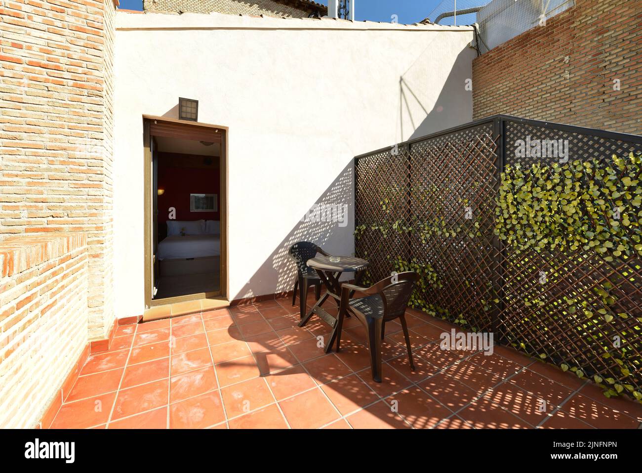 Terrace in a penthouse apartment with black wooden latticework and ...