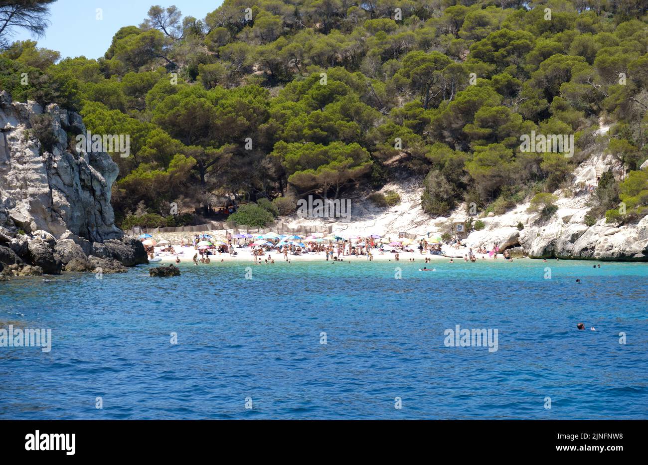 Menorca, Spain: Beautiful bay with sailing boat catamaran Stock Photo ...