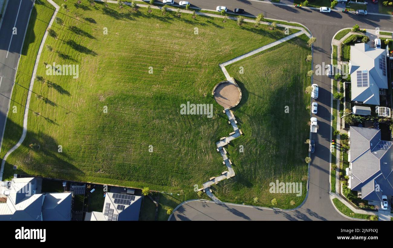 The aerial view of the green lawn with a circular pathway Stock Photo ...
