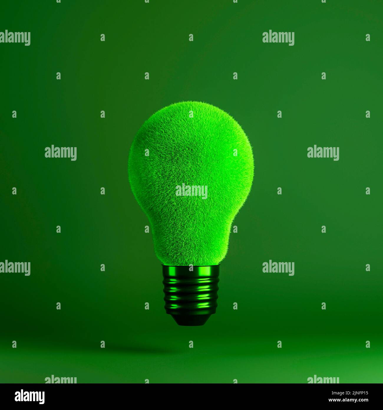 Green grass texture of light bulb on green background. Concept of ...