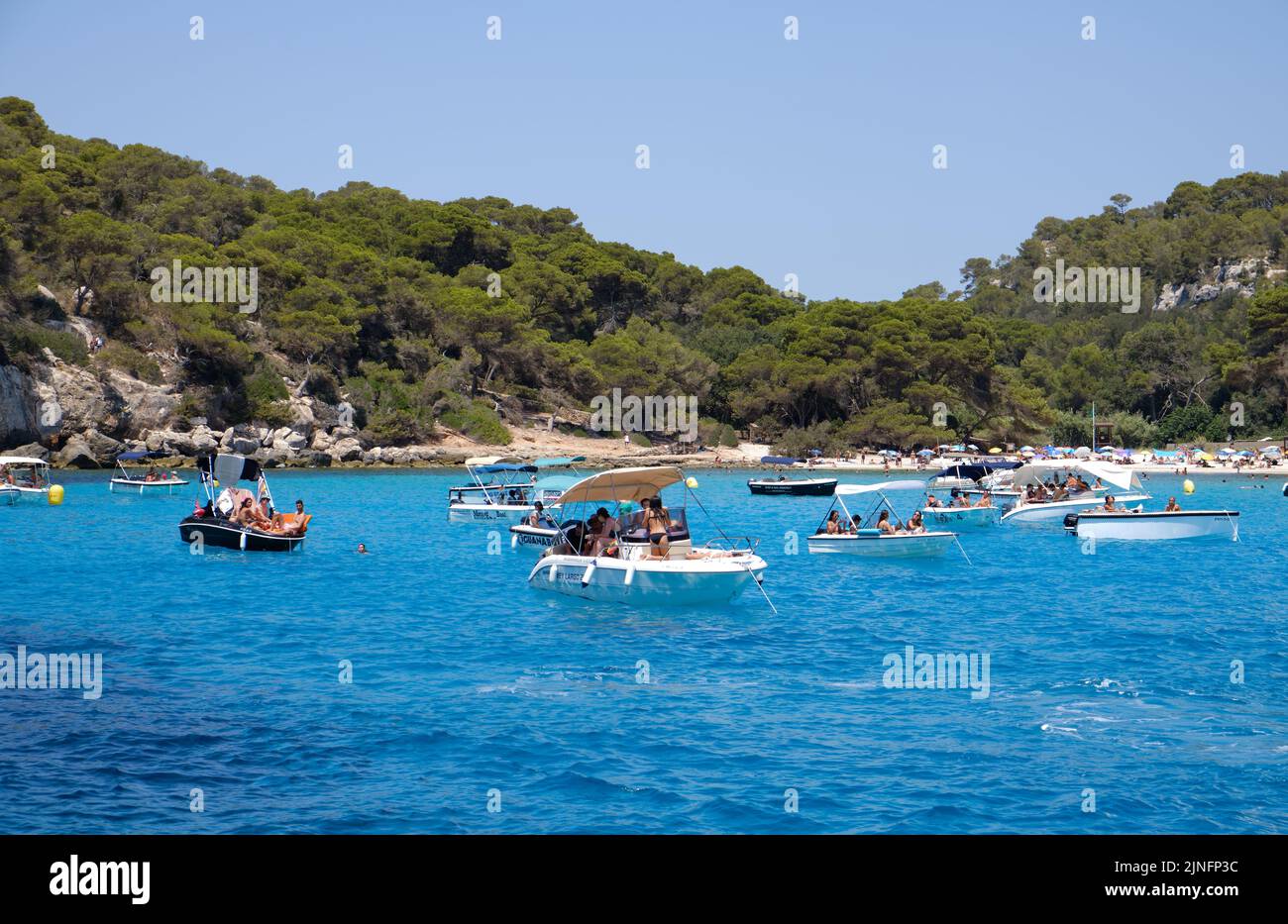 Menorca, Spain: Beautiful bay with sailing boat catamaran Stock Photo ...