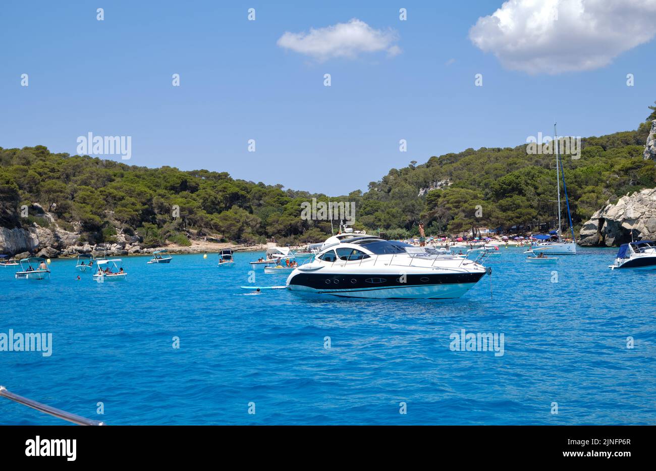 Menorca, Spain: Beautiful bay with sailing boat catamaran Stock Photo ...