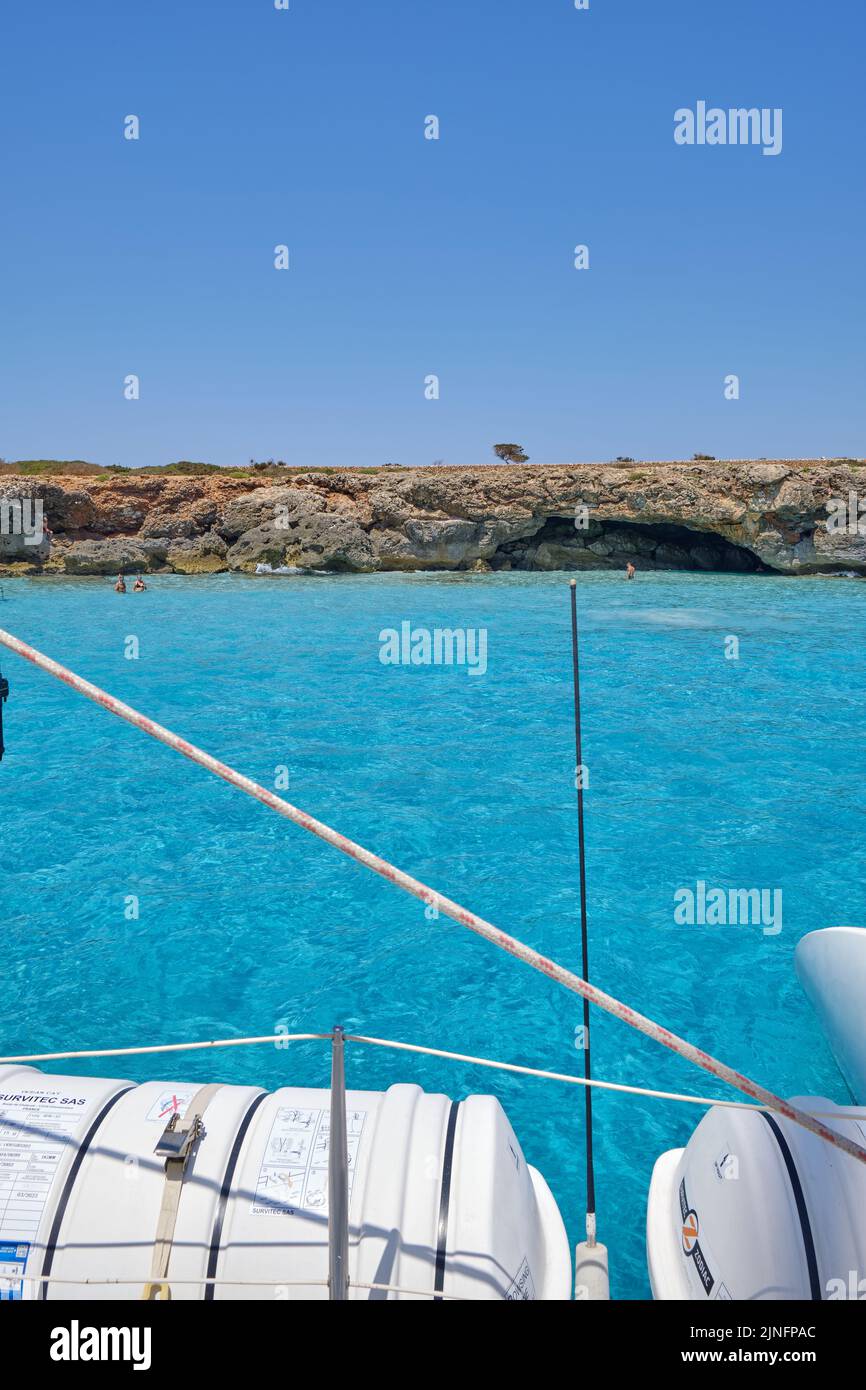 Menorca, Spain: Beautiful bay with sailing boat catamaran Stock Photo ...