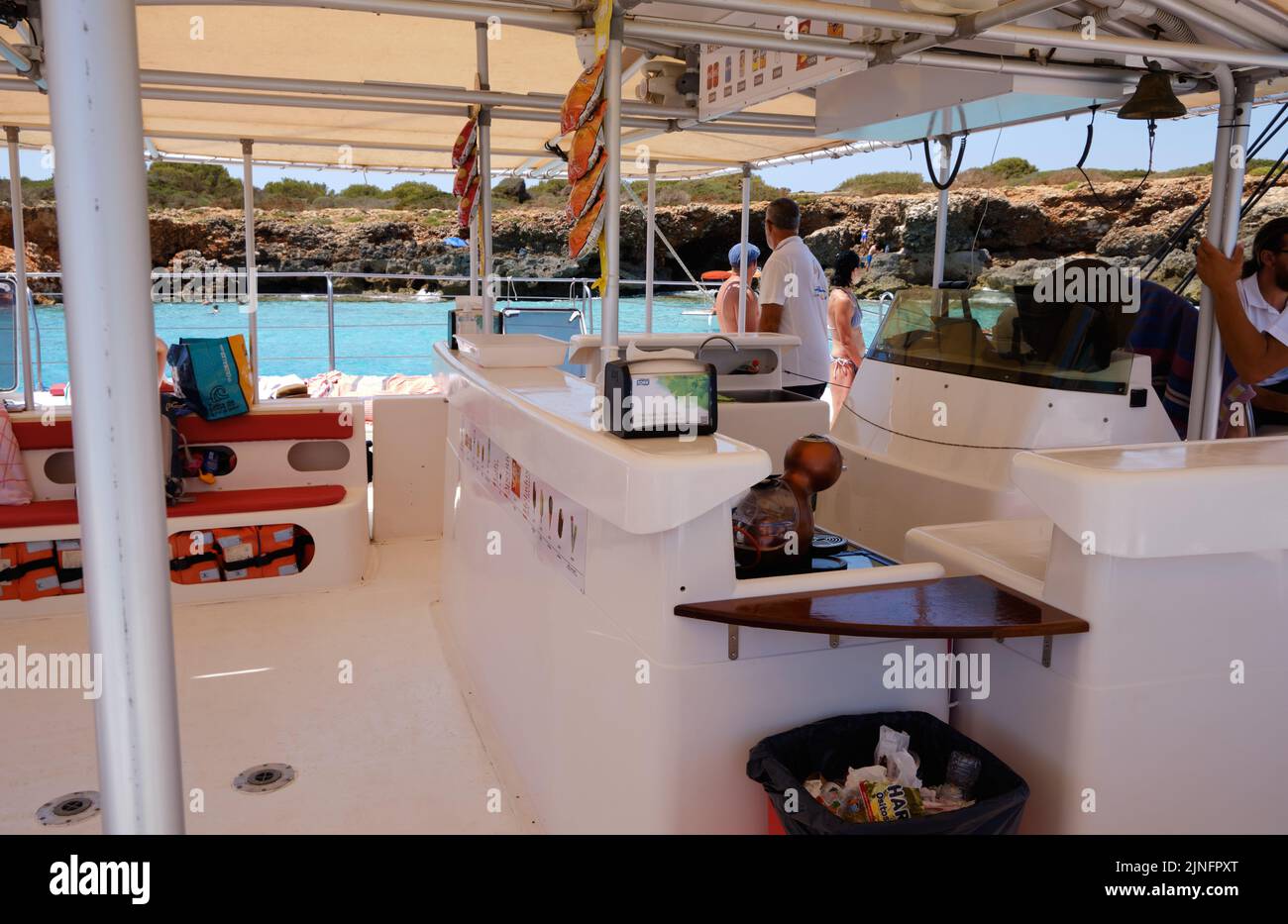 Menorca, Spain: Beautiful bay with sailing boat catamaran Stock Photo ...