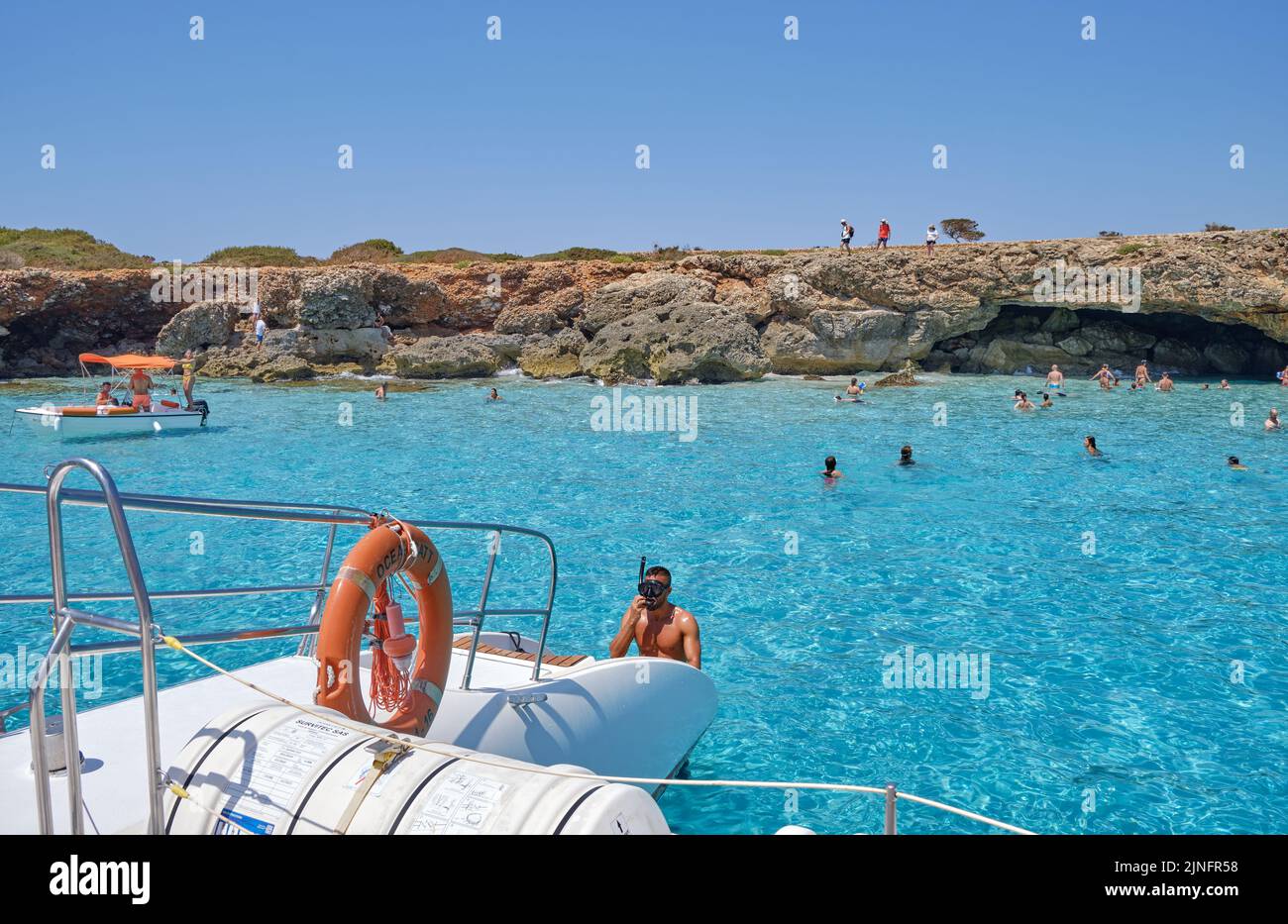 Menorca, Spain: Beautiful bay with sailing boat catamaran Stock Photo ...
