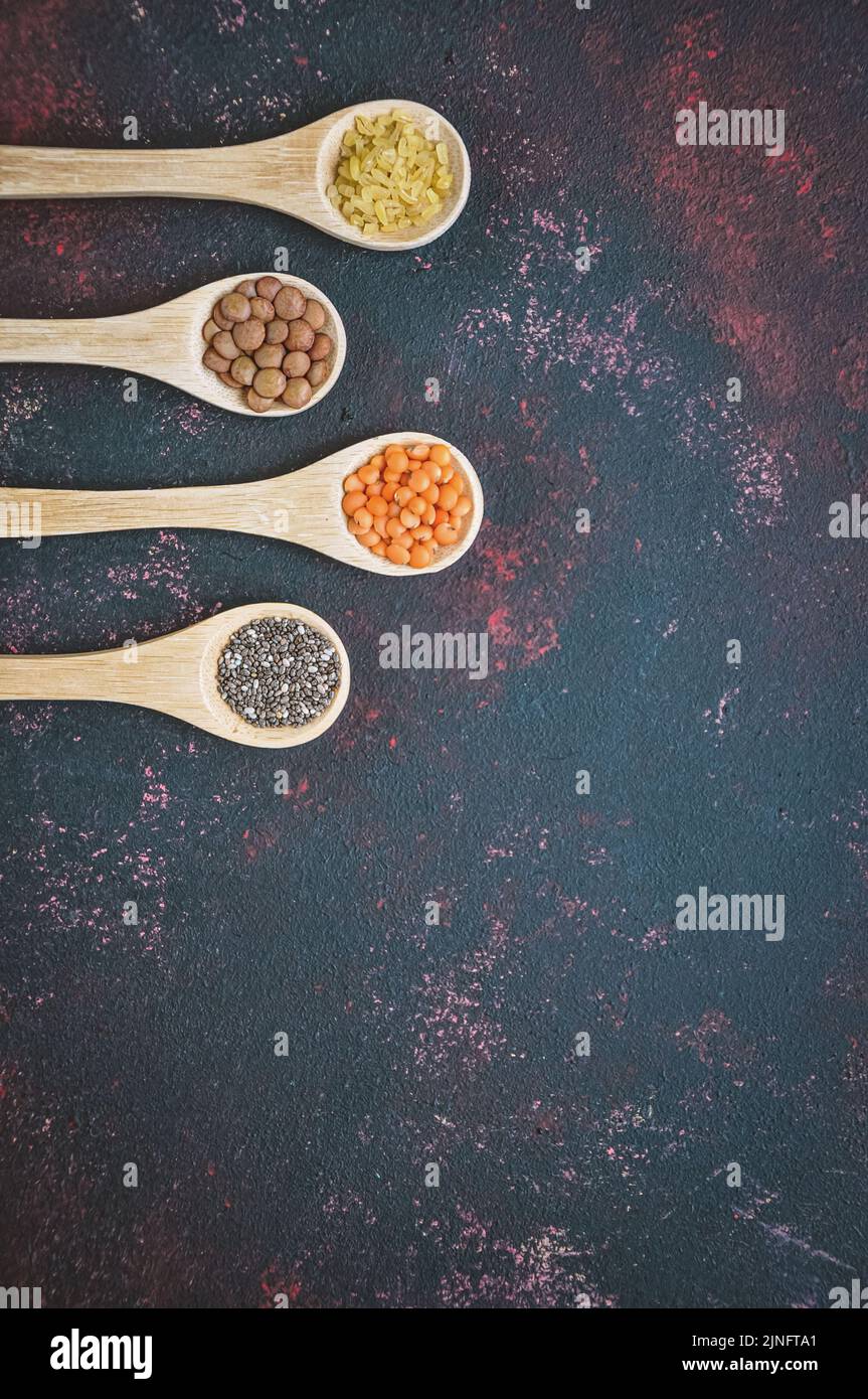 Different or various types of dry beans or dried legumes in wooden ...