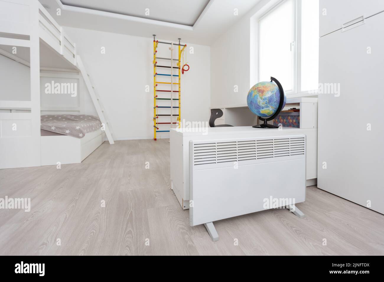 Modern electric heater in stylish room interior Stock Photo - Alamy