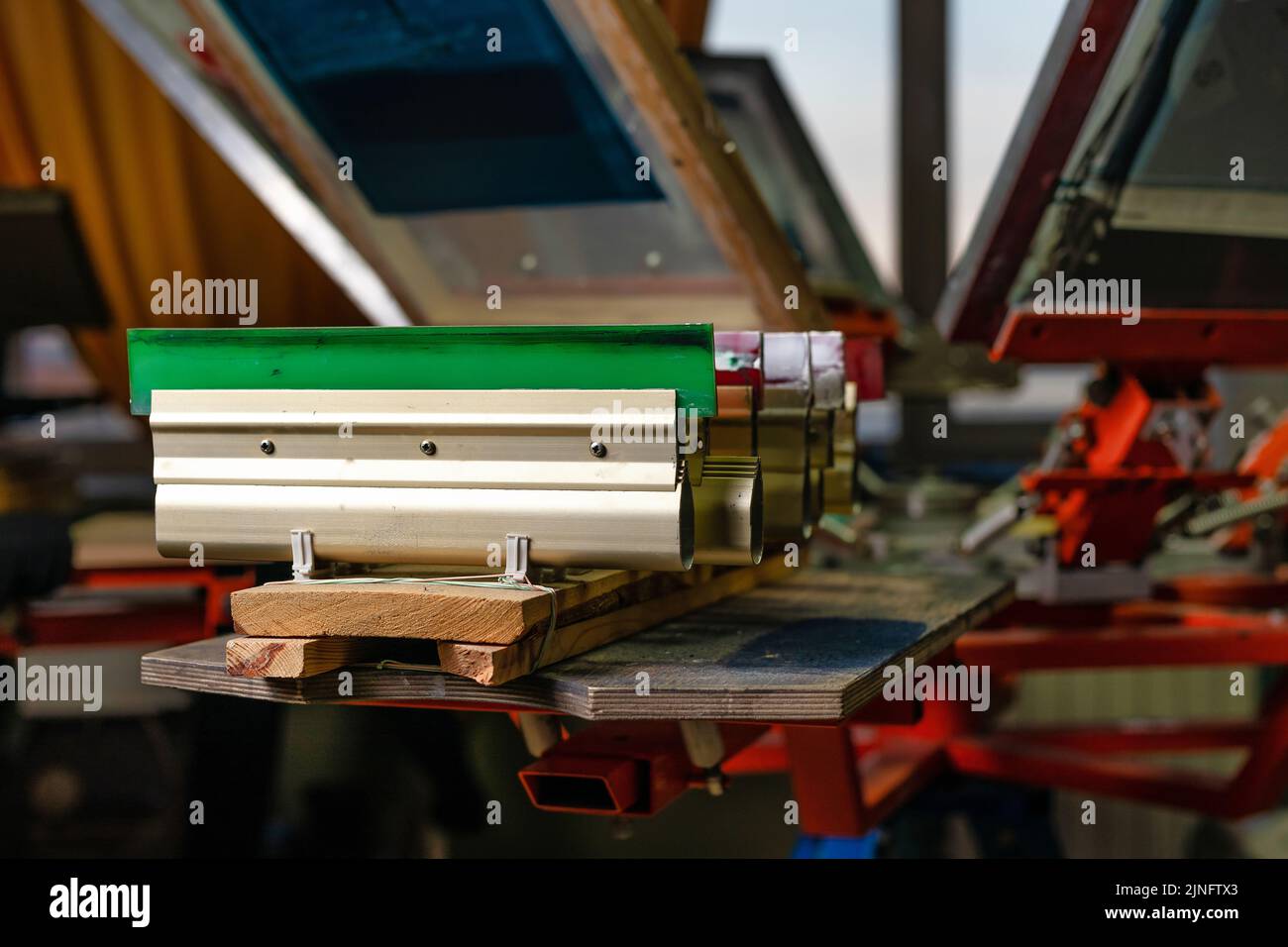 serigraphy production. squeegees on wooden shelve of the print ...