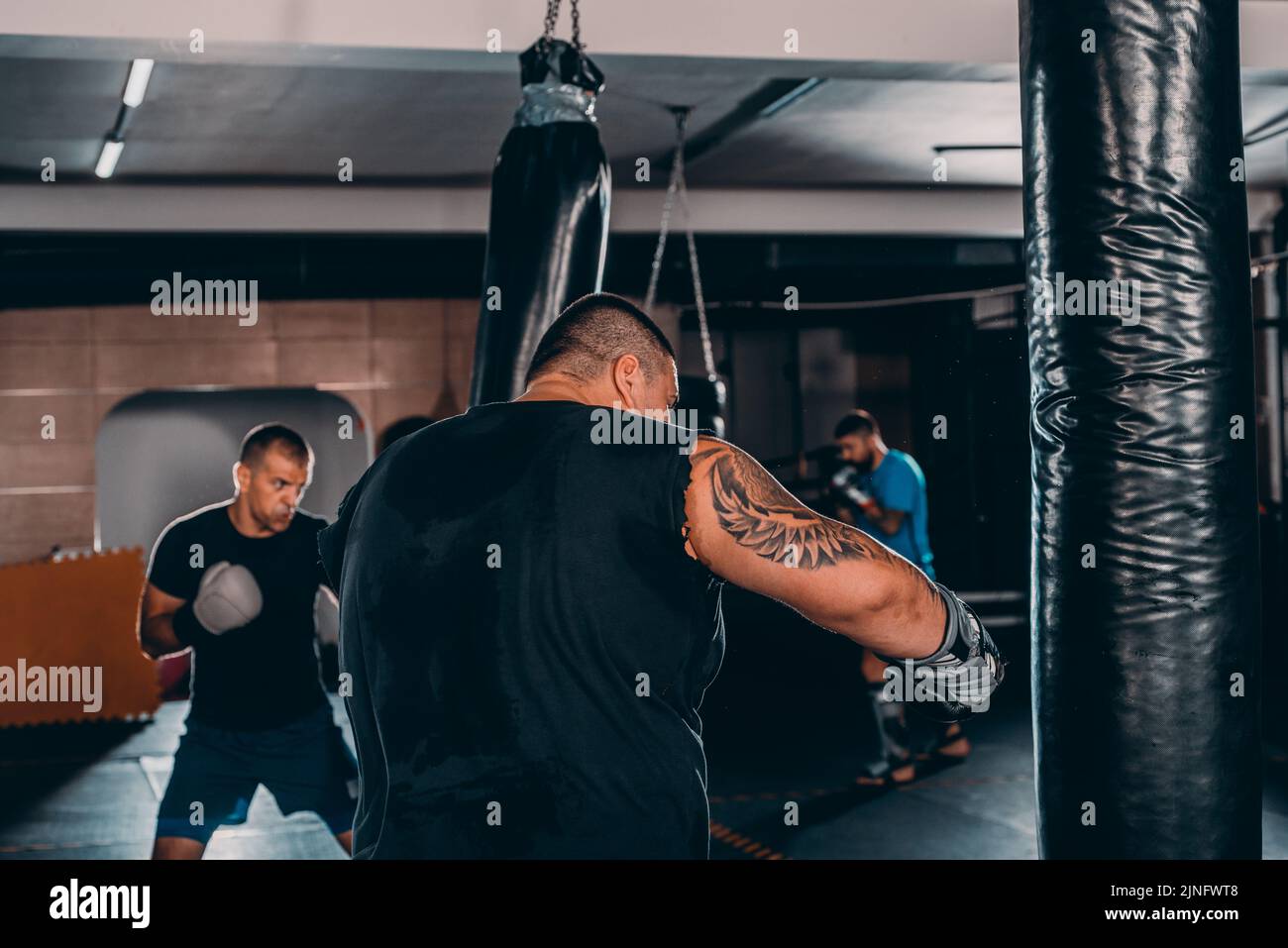 Professional boxer training at gym, practicing kicks and punches Stock ...
