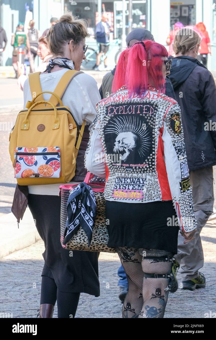 Blackpool, Lancashire, UK Augusd 6 2022 Two girls with contrasting hair ...