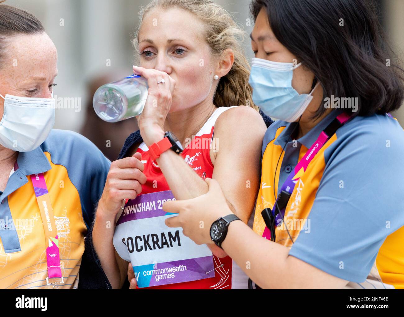 An exhausted Natasha Cockram, Wales, is assisted by medics following ...