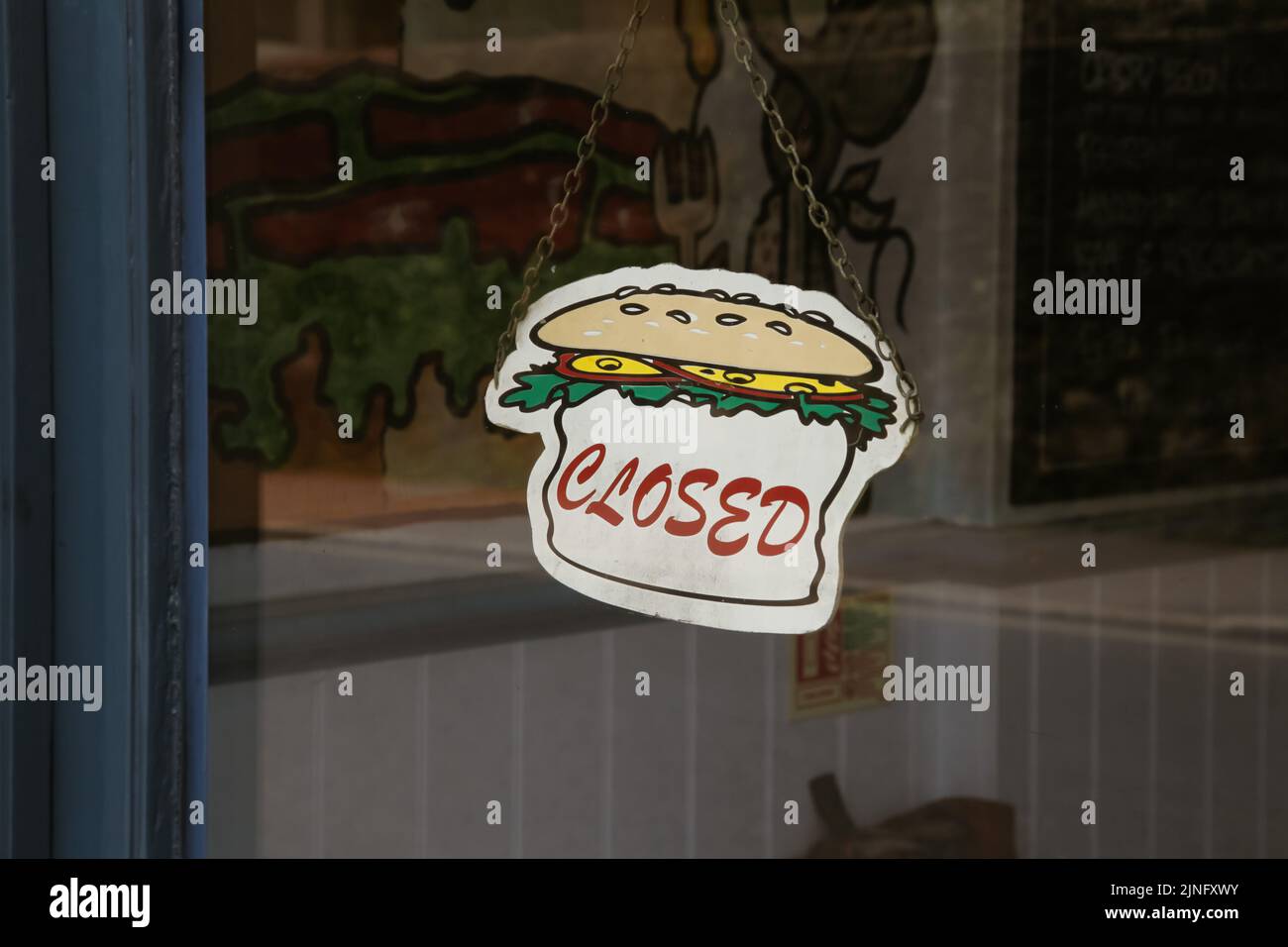 A cafe closed sign in shape of a burger, Dorking, Surrey, England, UK ...