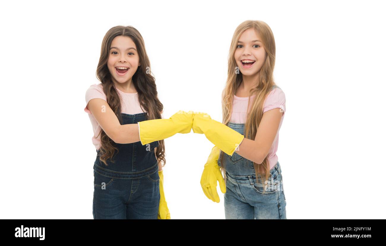 Lets start cleaning. Kids cleaning together. Girls with yellow rubber ...