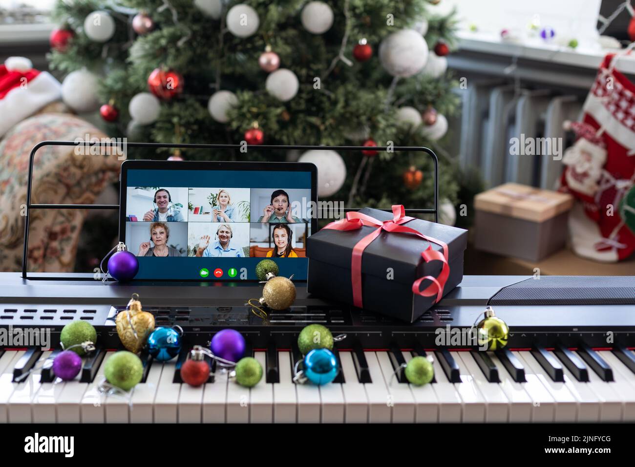 Christmas video call tablet. synthesizer, piano keys Stock Photo - Alamy