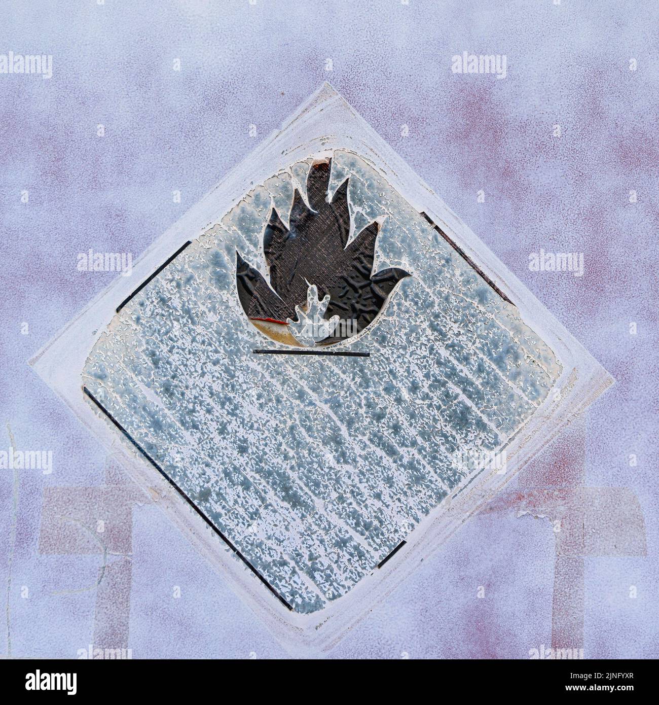 Faded Colour From Flammable Warning Damaged Fire Sign Stock Photo - Alamy