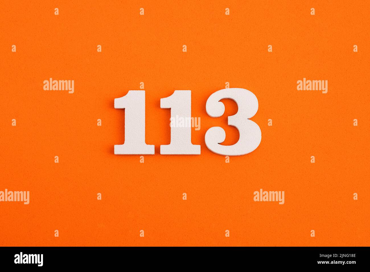 Number 113 - On orange foam rubber background Stock Photo - Alamy