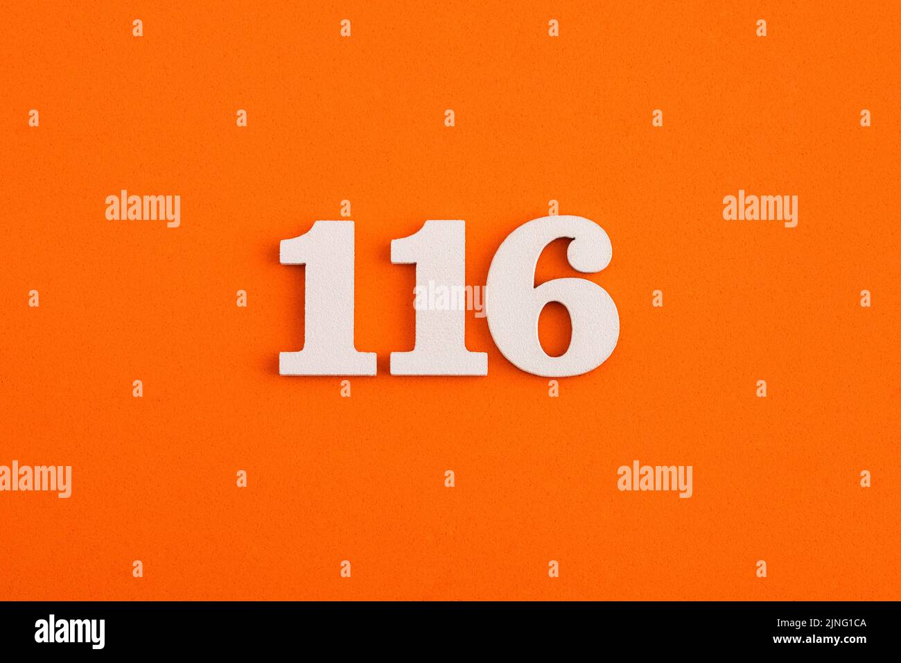 White wooden number 116 on eva rubber orange background Stock Photo - Alamy