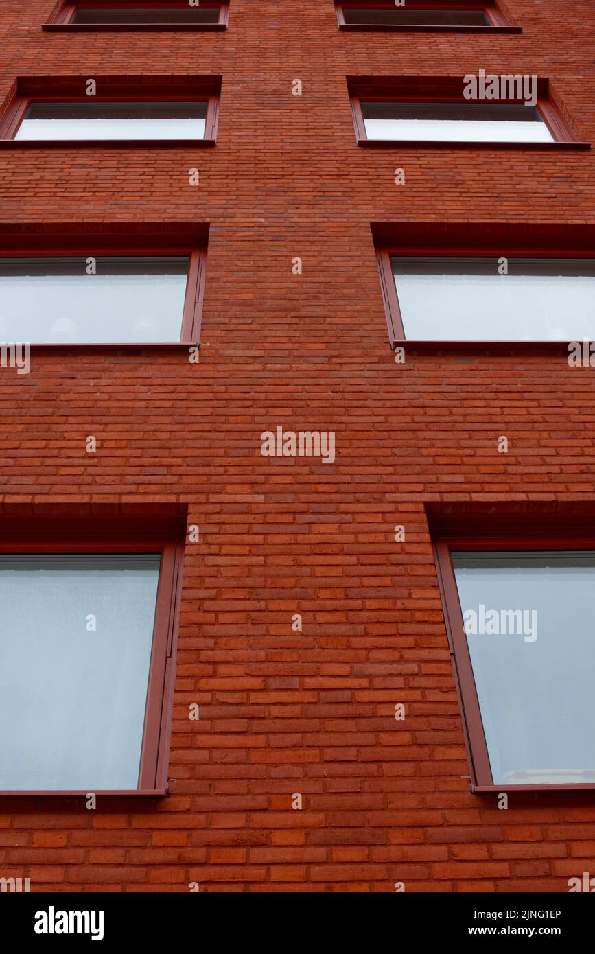 red brick building with glass windows Stock Photo - Alamy