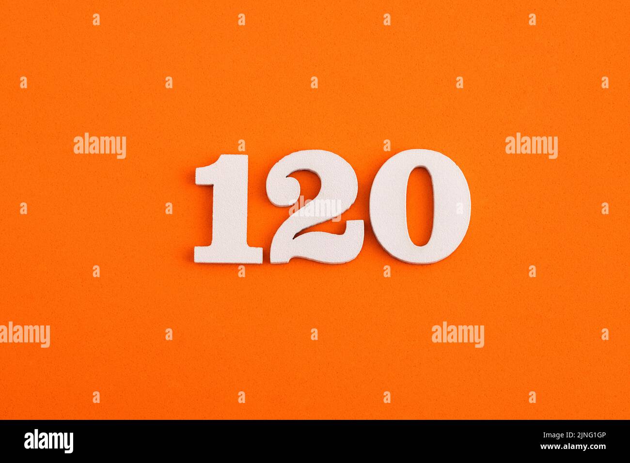 White wooden number 120 on eva rubber orange background Stock Photo - Alamy