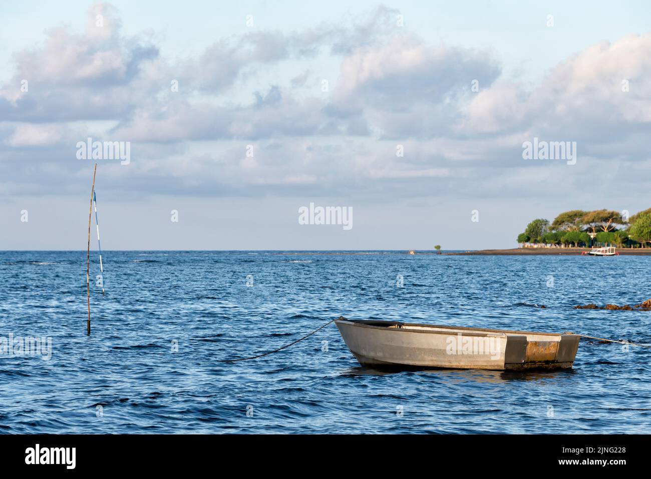 Metal boat on the sea in Bali Stock Photo - Alamy