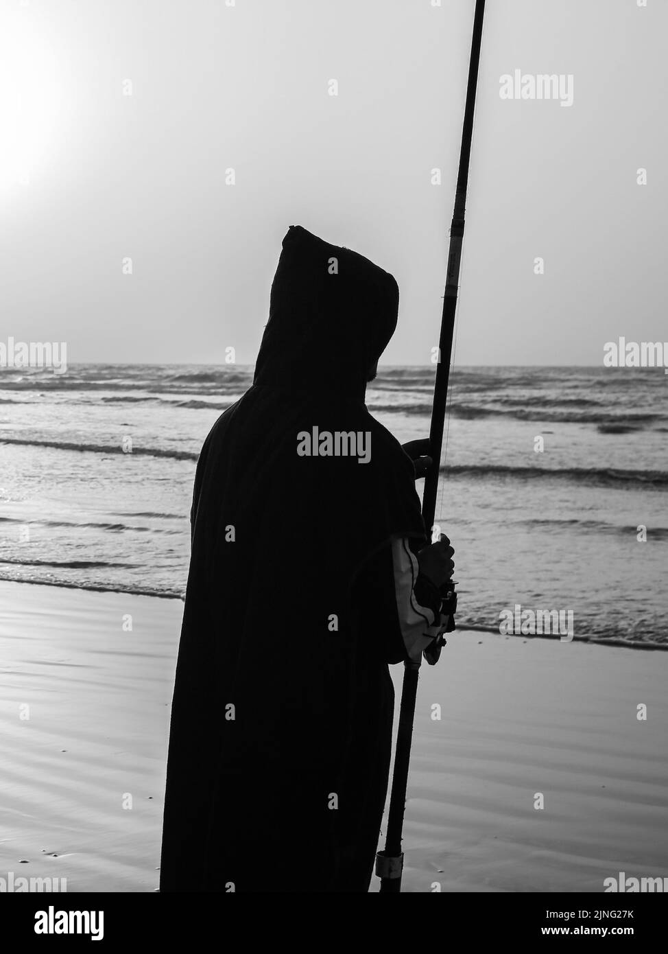 A Fisher man holding his hook with his fisher rod with a beautiful ...