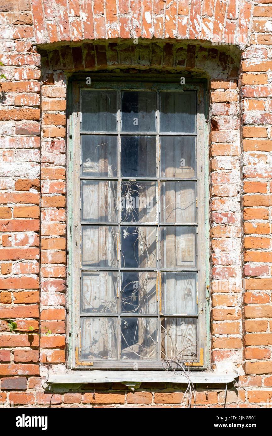 Broken window, of an old dilapidated deserted brick building Stock ...